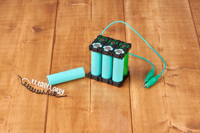 Lithium Battery Pack in Black Plastic Holder on Wooden Table Stock ...