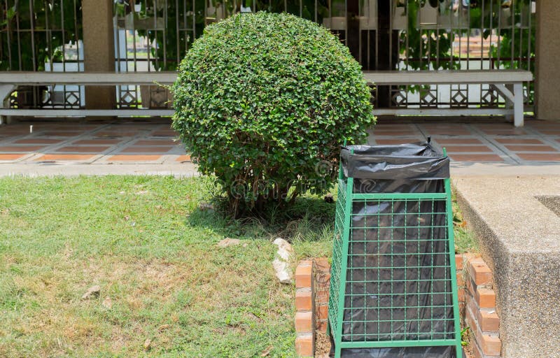A Litter Bin in a Park on the Grass. Public Rubbish Bin in a Park Stock ...