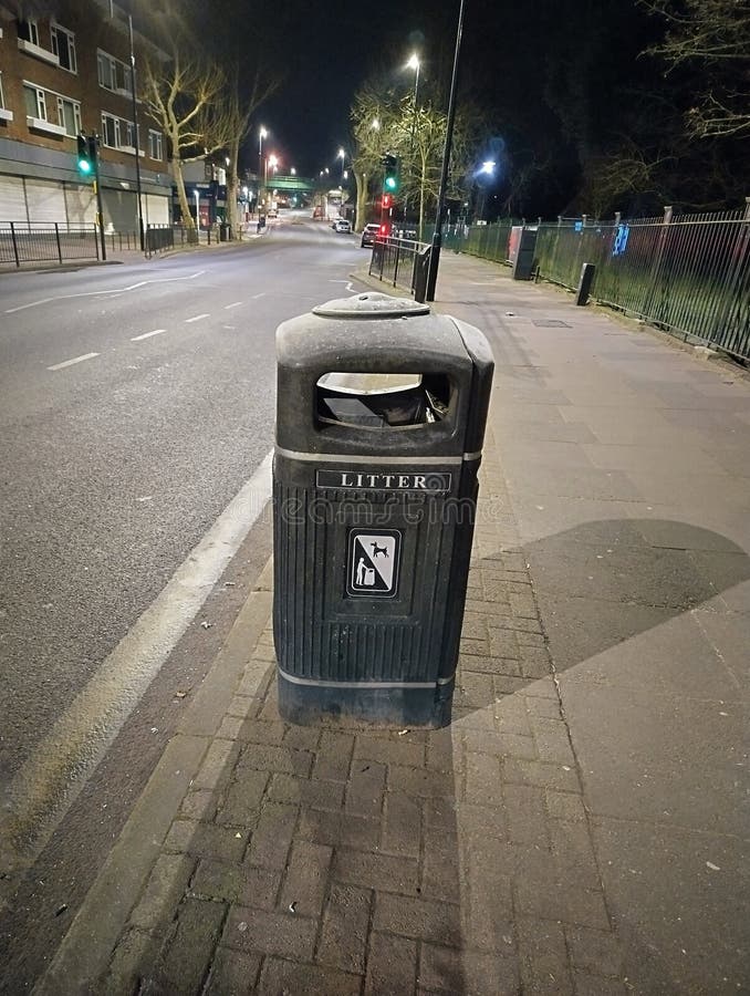 Litter or Black Rubbish Bin in the Street with Ice on Top during Winter ...
