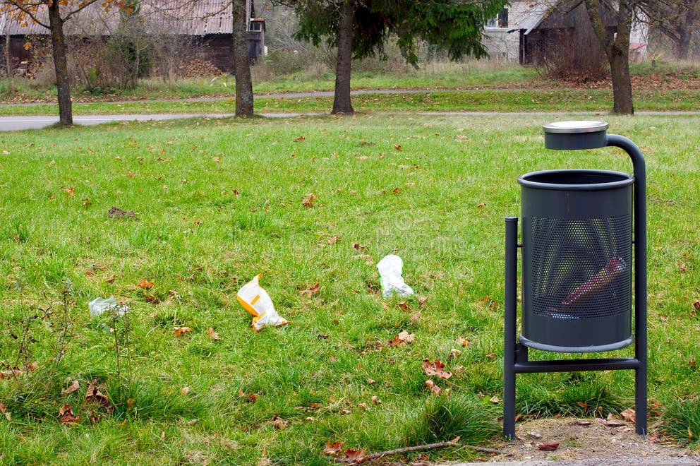 Litter Can, Garbage Around Scatter on Green Grass Stock Image - Image ...