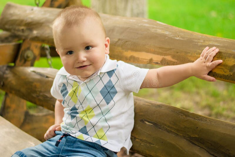 Little Adorable Baby Sit on a Bench Stock Image - Image of jeans ...