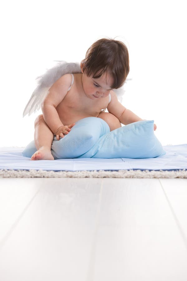 Little Angel Playing with Pillows Stock Photo - Image of costume ...