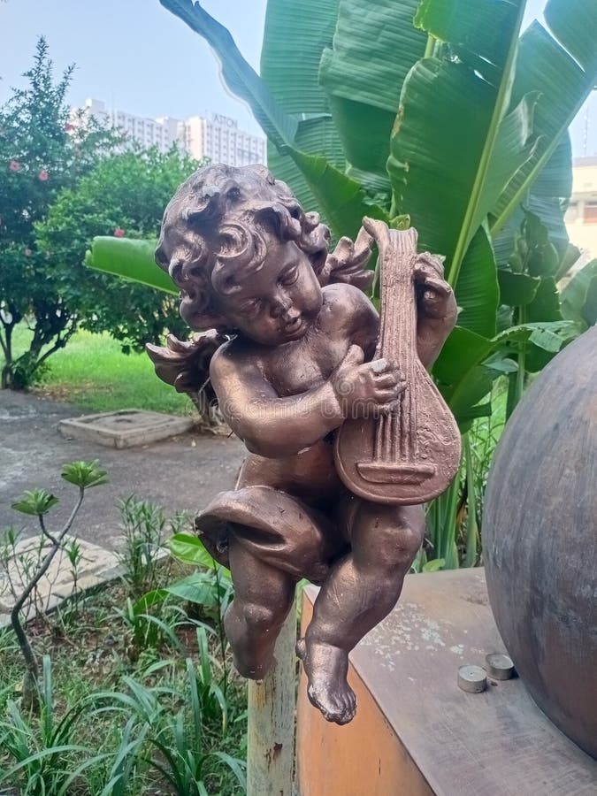 Little Angel Statue Playing Music. a Work of Art of Great Value ...