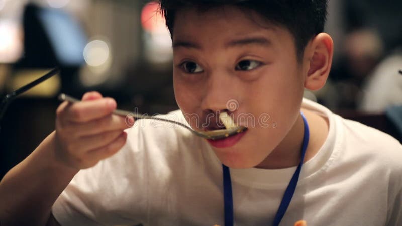 Little Asian Boy Eating Fried Rice . Stock Video - Video of meal, food ...