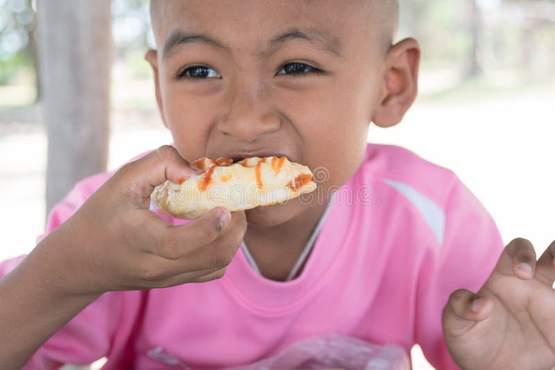 Cute Little Asian Boy Eating Snack Stock Photo - Image of asian, dinner ...