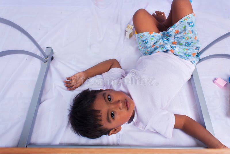 Little Asian Boy Lying Under Table Stock Photos - Free & Royalty-Free ...