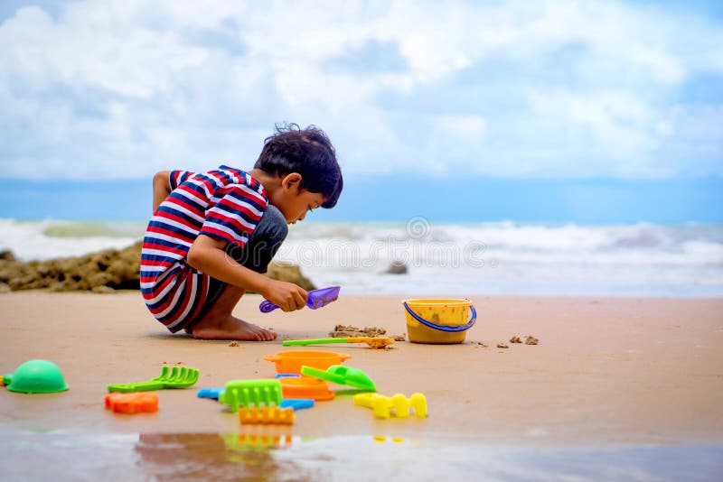 Little Asian Boy Play with Sand on the Beach Stock Image - Image of ...