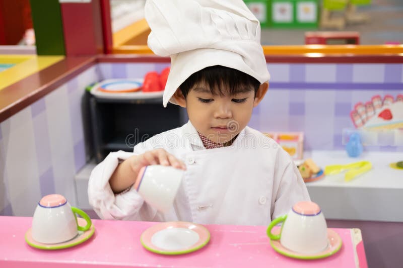 Little Asian Boy Playing Chef Serving Food Stock Image - Image of ...