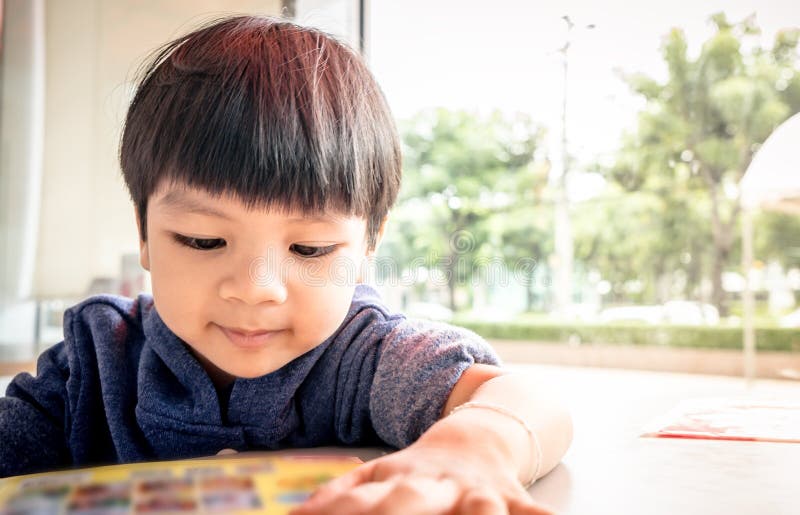 Little Asian Boy is Reading a Book Stock Image - Image of school, small ...