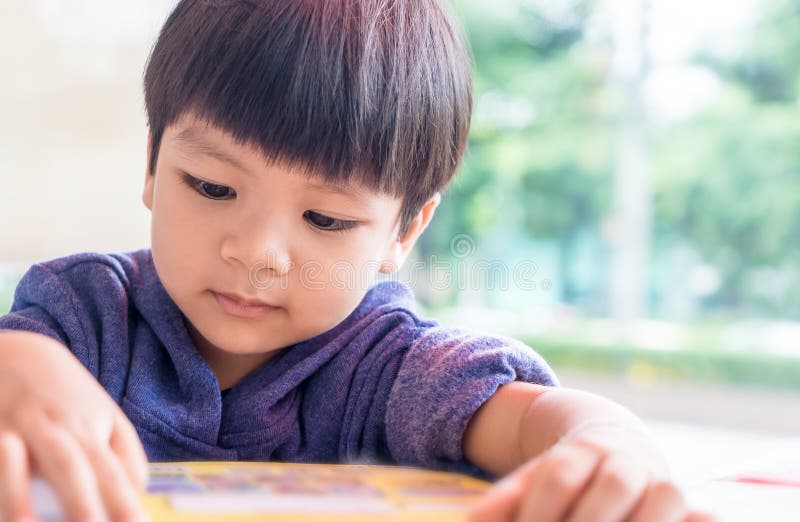 Little Asian Boy is Reading a Book Stock Image - Image of person, small ...