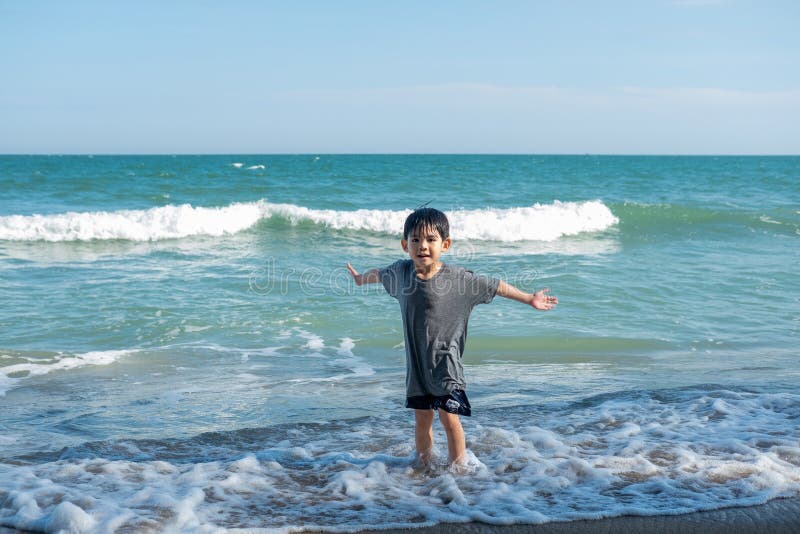 Little Asian Boy Showing Happy Expression on the Sea Beach Stock Photo ...