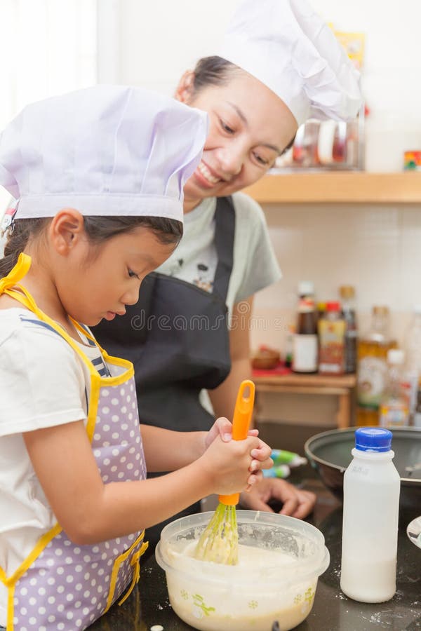 Little Asian Girl and Mother Making Pancake Stock Image - Image of ...