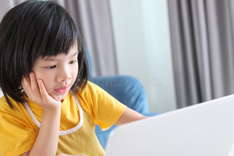 Little Asian Girl Student Study Online Using Laptop Computer at Home ...