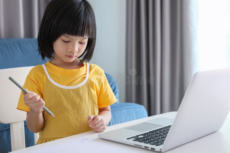 Little Asian Girl Student Study Online Using Laptop Computer at Home ...