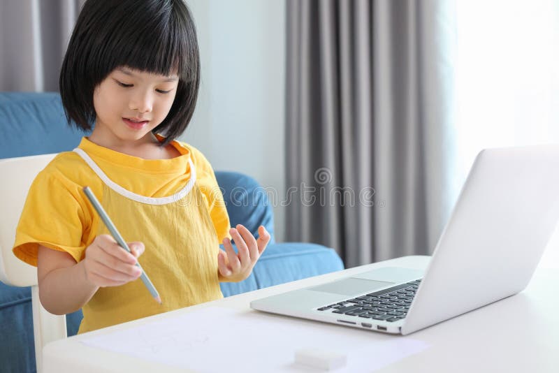 Little Asian Girl Student Study Online Using Laptop Computer at Home ...