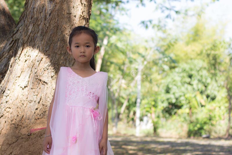 Little Asian Girl with Tree Stock Photo - Image of girl, asian: 79603566