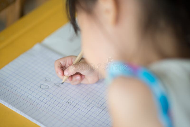 Little Asian Girl Writing in the Notebook School Stock Photo - Image of ...
