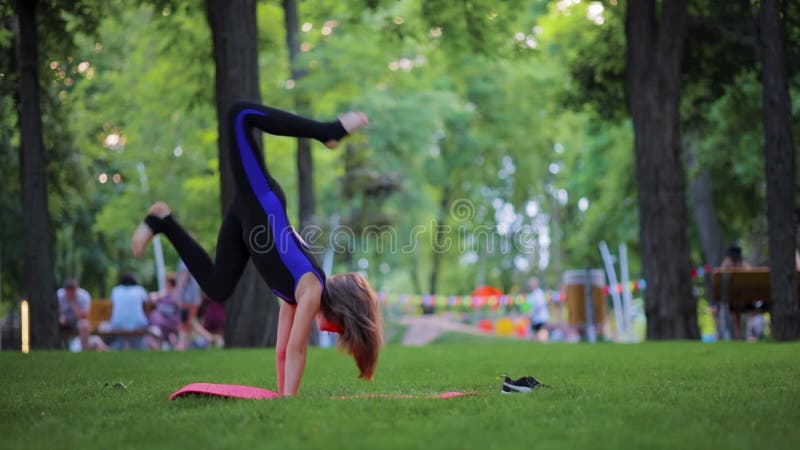Little Girl Gymnast Doing Acrobatic Bridge Element Stock Footage ...