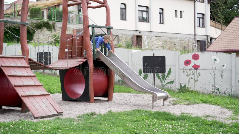 Little Autistic Boy Playing on Playground Stock Video - Video of moving ...