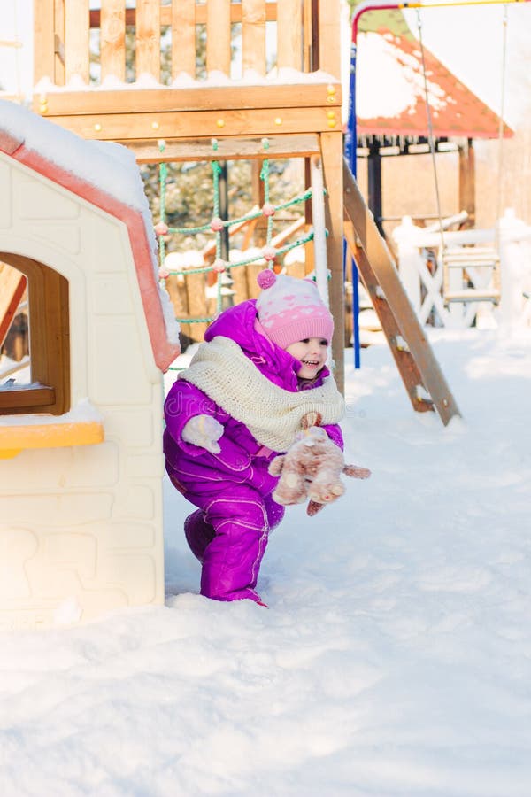 Little Babe Girl Playing on the Winter Playground. Stock Image - Image ...