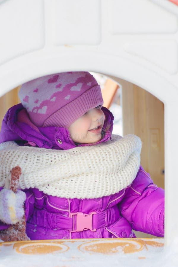 Little Babe Girl Playing on the Winter Playground. Stock Photo - Image ...
