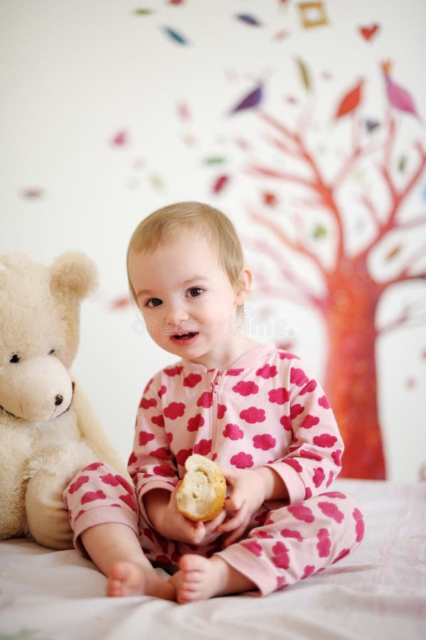 Little Baby in Bed Wearing Red Pyjamas Stock Image - Image of blonde ...