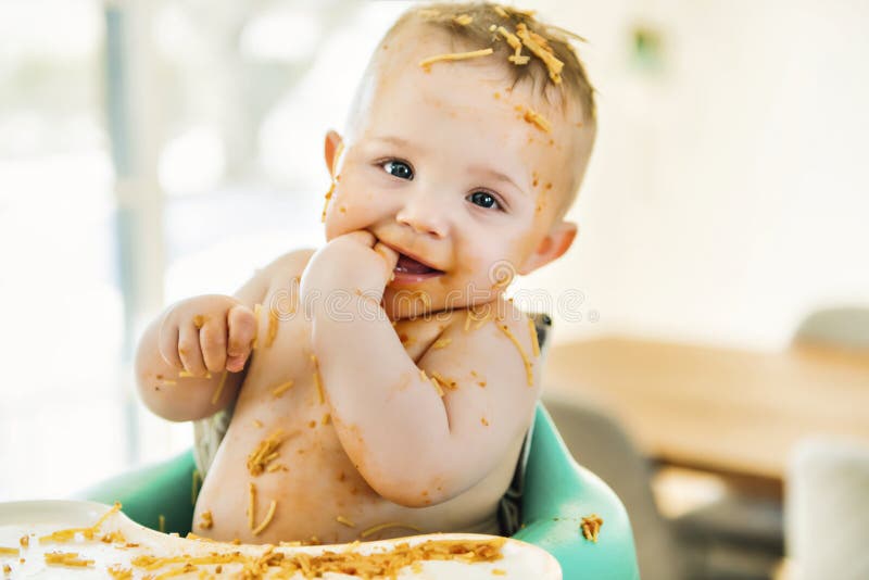 Little Baby Boy Eating Her Dinner and Making a Mess Stock Photo - Image ...