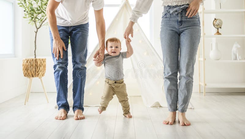 Little Baby Boy First Steps with the Help of Parent Stock Image - Image ...
