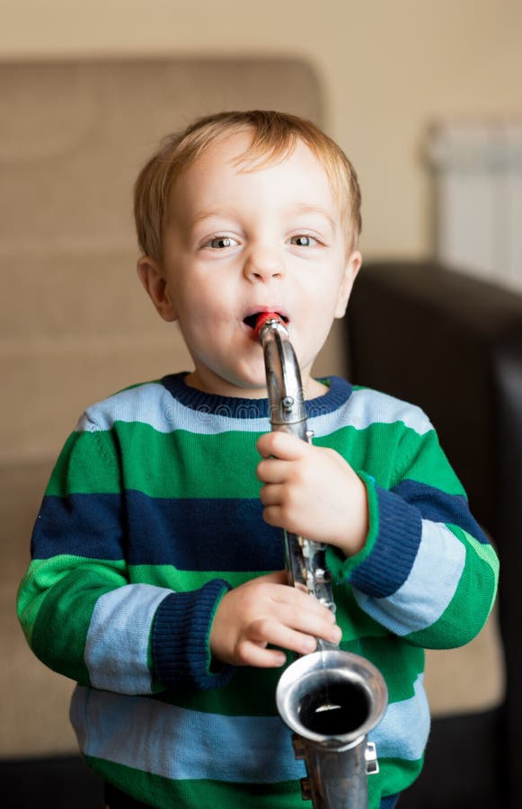 Little Baby Boy Playing a Saxophone Stock Image - Image of focused ...