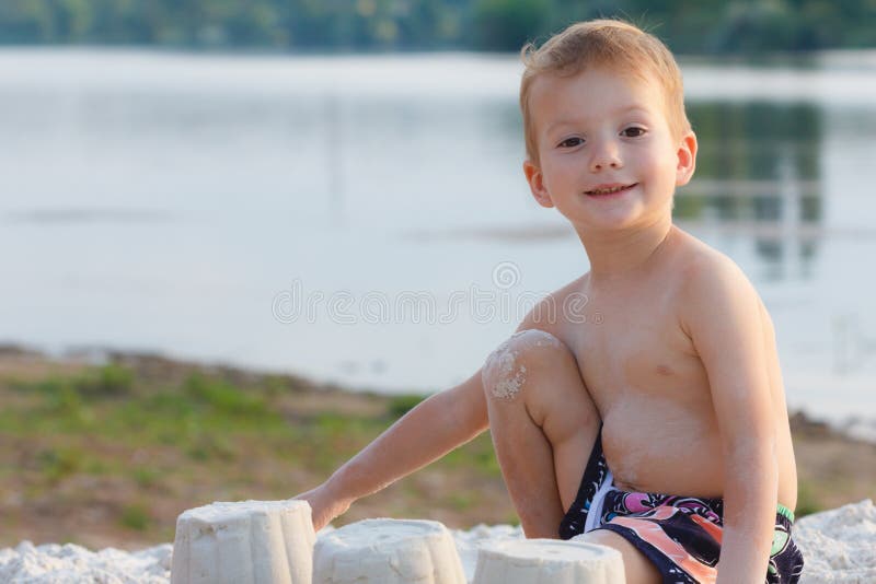 Little Baby Boy is Resting on the Sandy Shore, Build a Castle Stock ...
