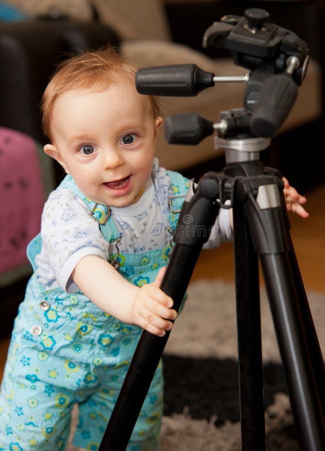 Little baby boy and tripod stock image. Image of happy - 24491115