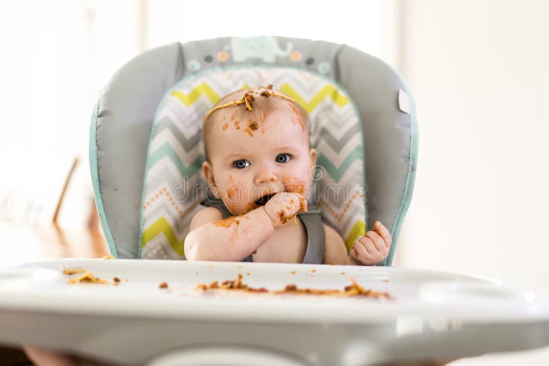 Little Baby Eating Her Dinner and Making a Mess Stock Photo - Image of ...
