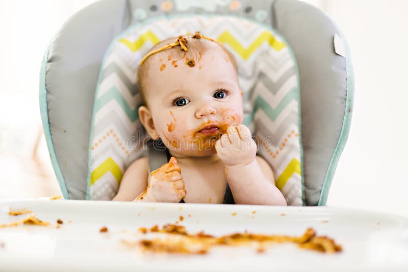 Little Baby Eating Her Dinner and Making a Mess Stock Photo - Image of ...