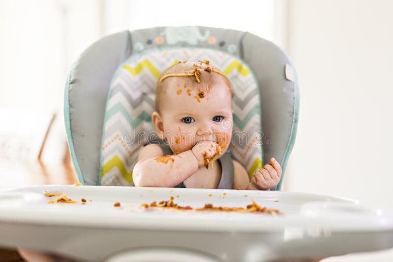 Little Baby Eating Her Dinner and Making a Mess Stock Image - Image of ...