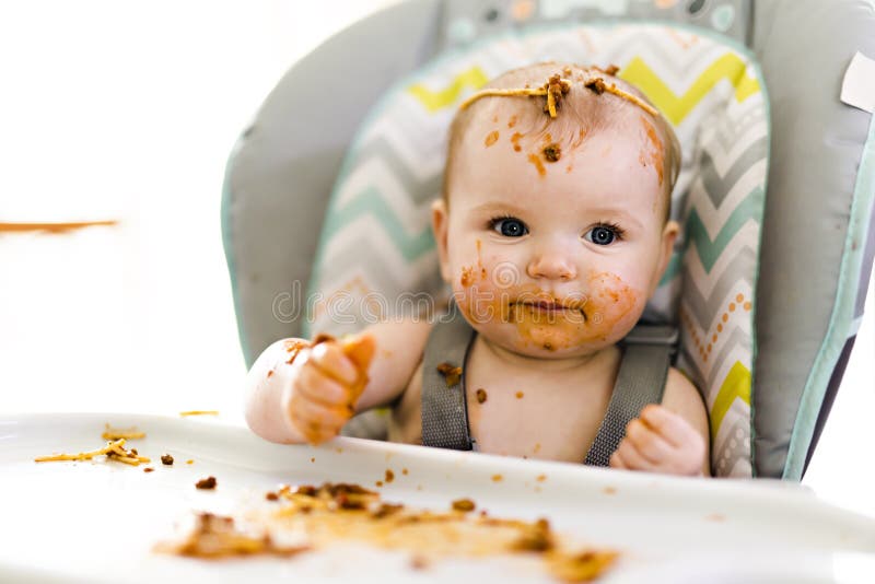 Little Baby Eating Her Dinner and Making a Mess Stock Photo - Image of ...