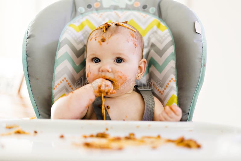 Little Baby Eating Her Dinner and Making a Mess Stock Photo - Image of ...