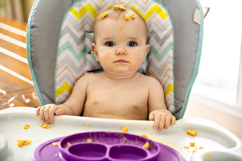 Little Baby Eating Her Dinner and Making a Mess Stock Photo - Image of ...