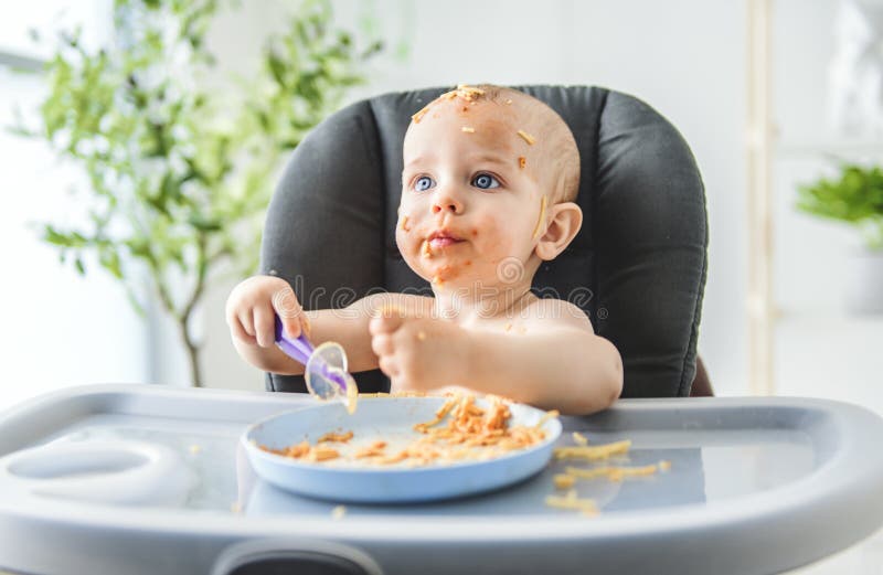 Little Baby Eating Her Dinner and Making a Mess Stock Image - Image of ...