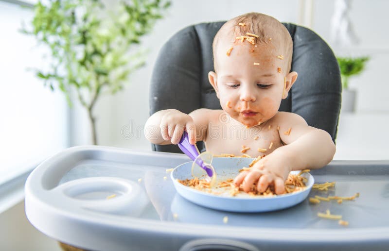 Little Baby Eating Her Dinner and Making a Mess Stock Image - Image of ...