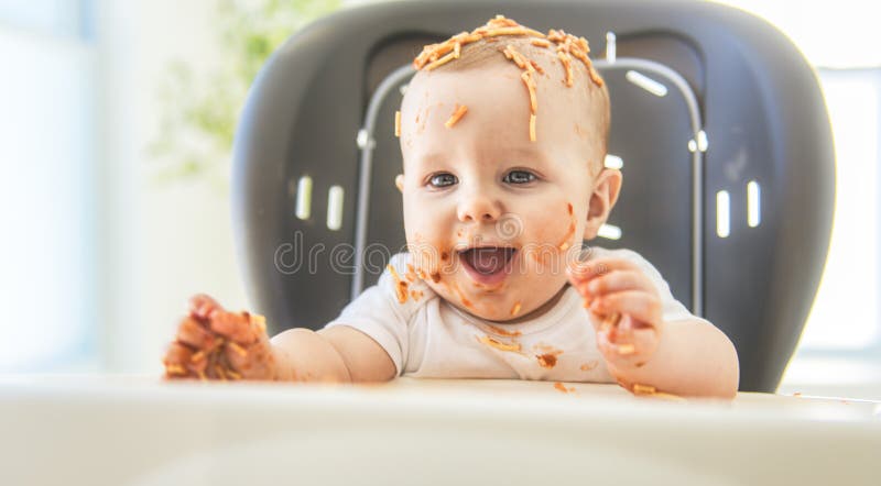 Little Baby Eating Her Dinner and Making a Mess Stock Photo - Image of ...