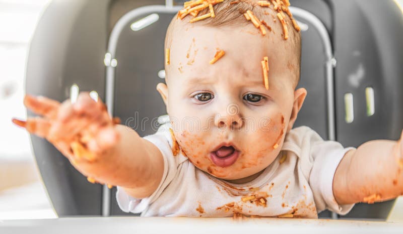 Little Baby Eating Her Dinner and Making a Mess Stock Photo - Image of ...