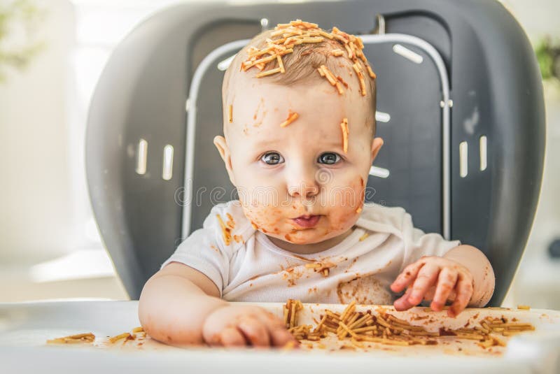 Little Baby Eating Her Dinner and Making a Mess Stock Photo - Image of ...