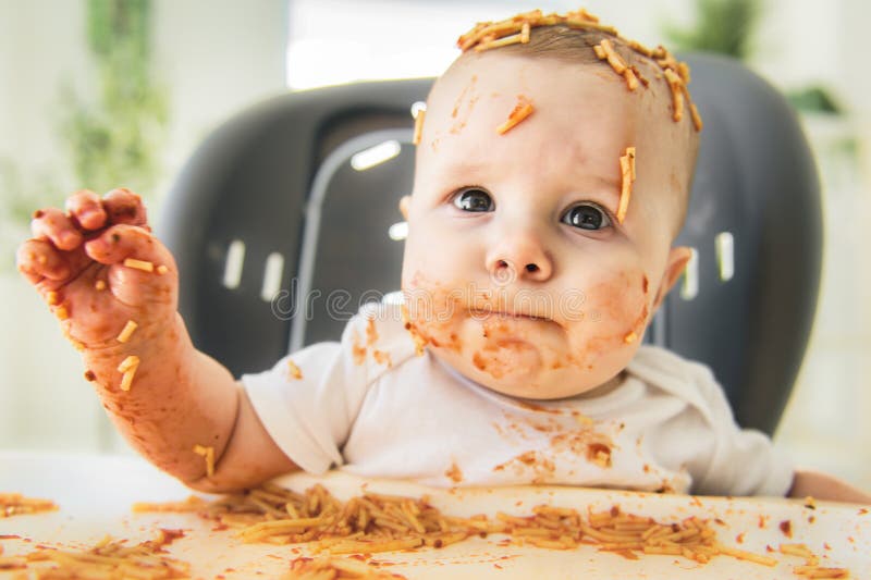 Little Baby Eating Her Dinner and Making a Mess Stock Photo - Image of ...