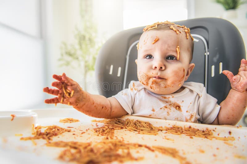 Little Baby Eating Her Dinner and Making a Mess Stock Photo - Image of ...