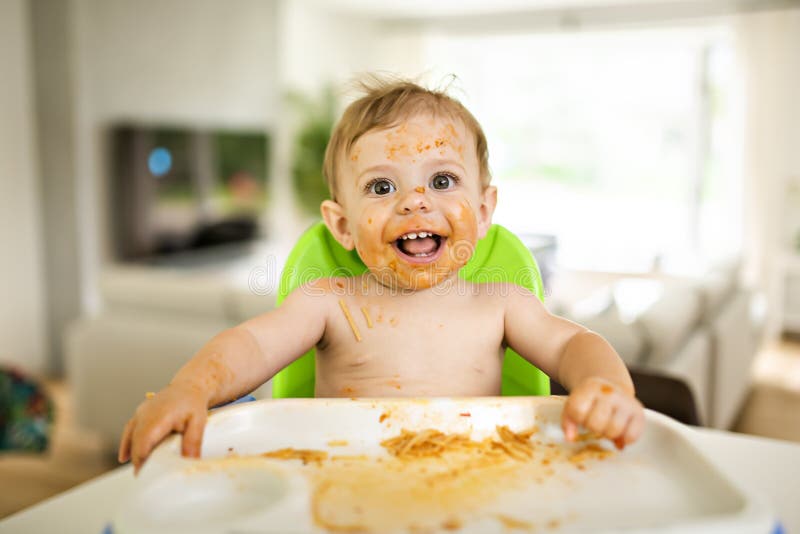 A Little Baby Eating Her Dinner and Making a Mess Stock Image - Image ...