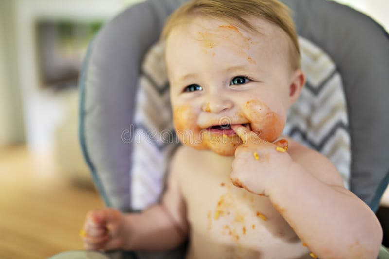 A Little Baby Eating Her Dinner and Making a Mess Stock Image - Image ...