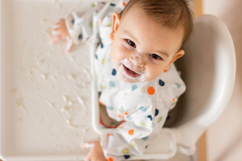 A Little Baby Eating Her Dinner and Making a Mess Stock Image - Image ...