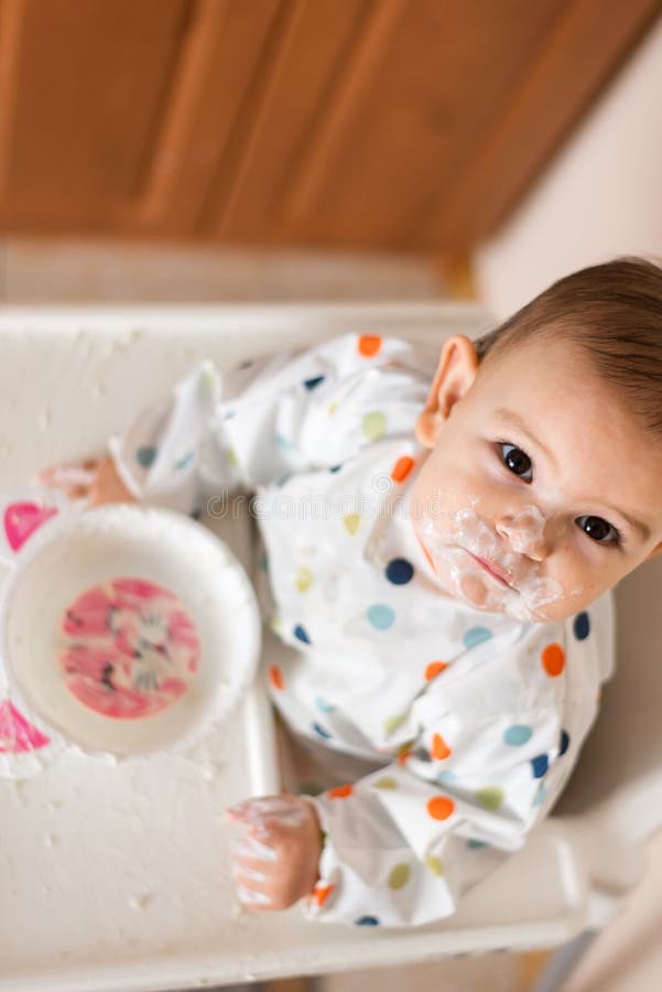 A Little Baby Eating Her Dinner and Making a Mess Stock Image - Image ...