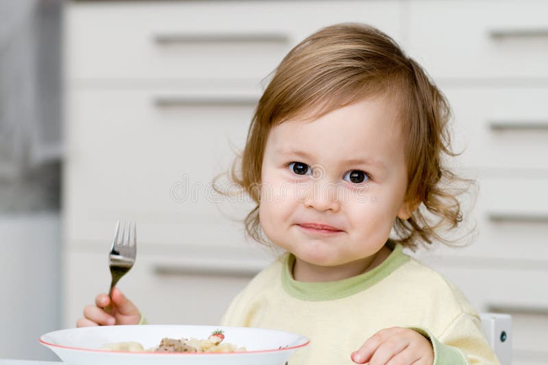 Little baby eating stock photo. Image of happiness, female - 70139364