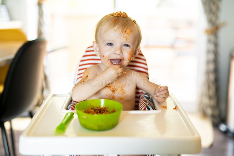 Little Baby Eating Spaghetti Dinner and Making a Mess Stock Image ...